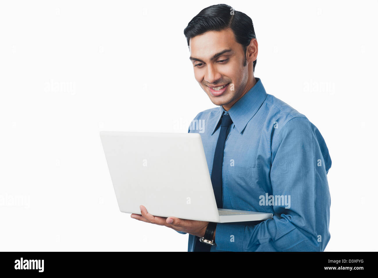 Bengali businessman using a laptop Stock Photo - Alamy