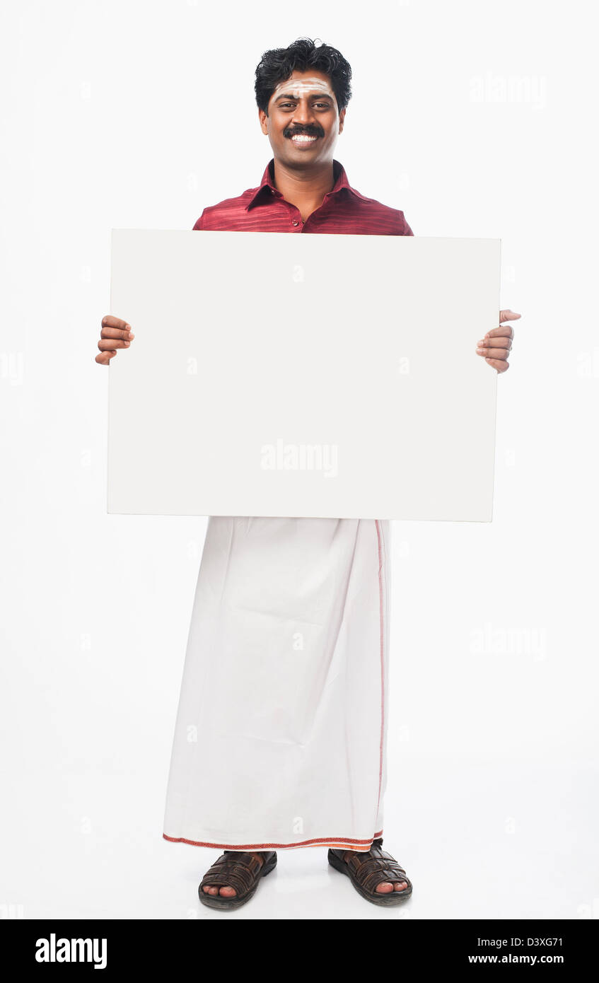 Smiling indian man standing Cut Out Stock Images & Pictures - Alamy