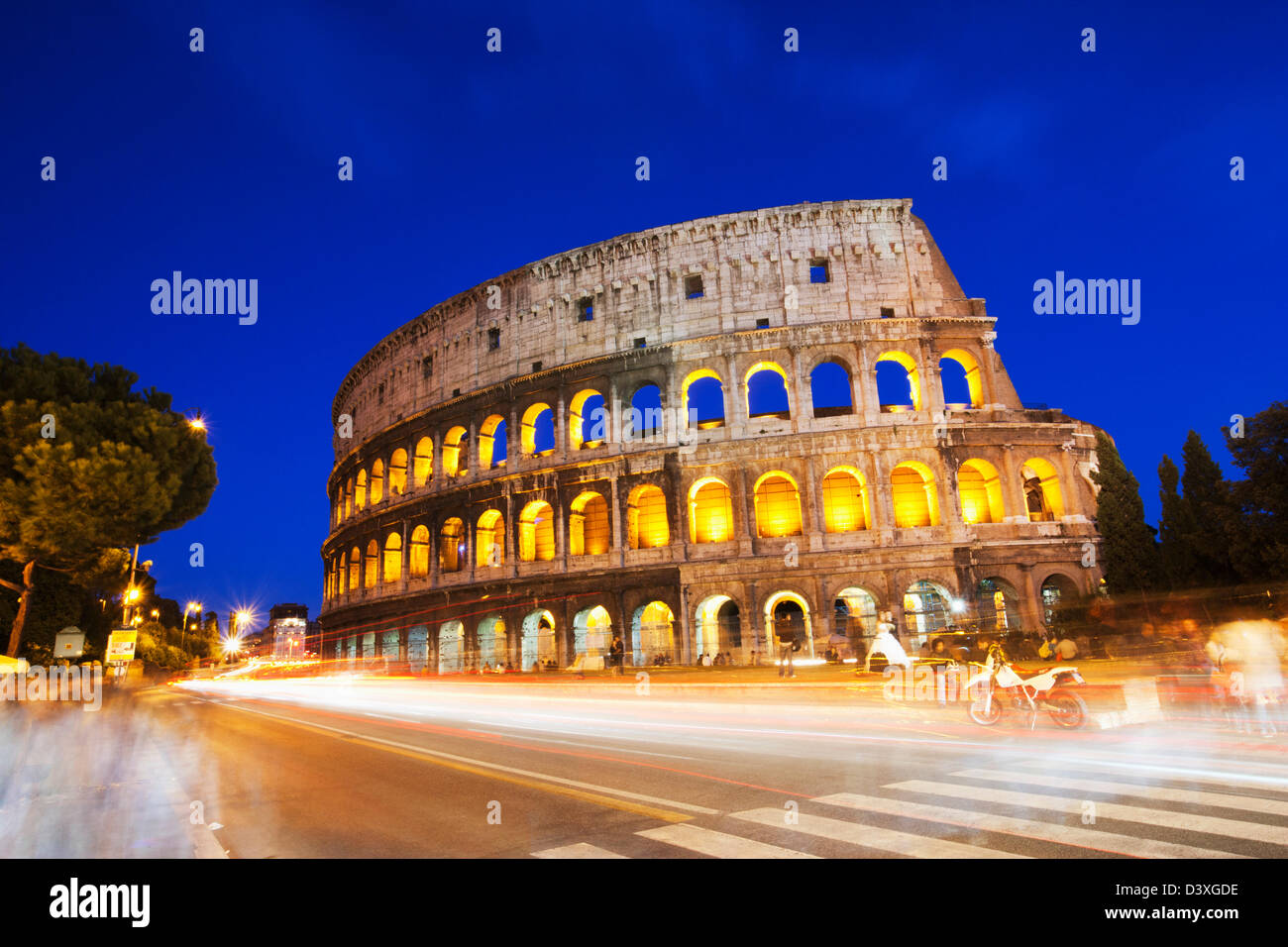 Night traffic in front of an Amphitheater, Colosseum, Rome, Lazio ...