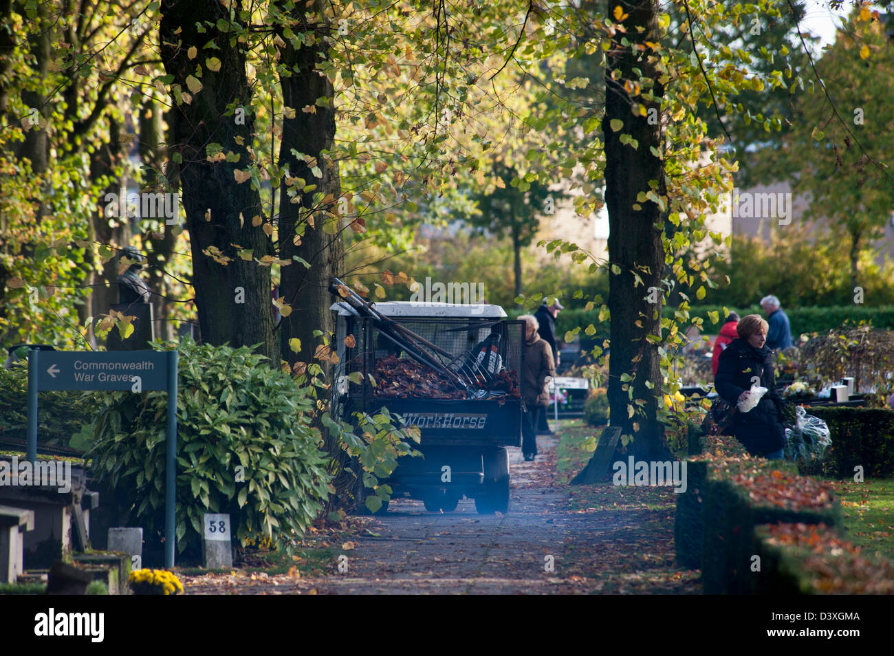 People are cleaning up the graves and the cemetery to get it ready for ...