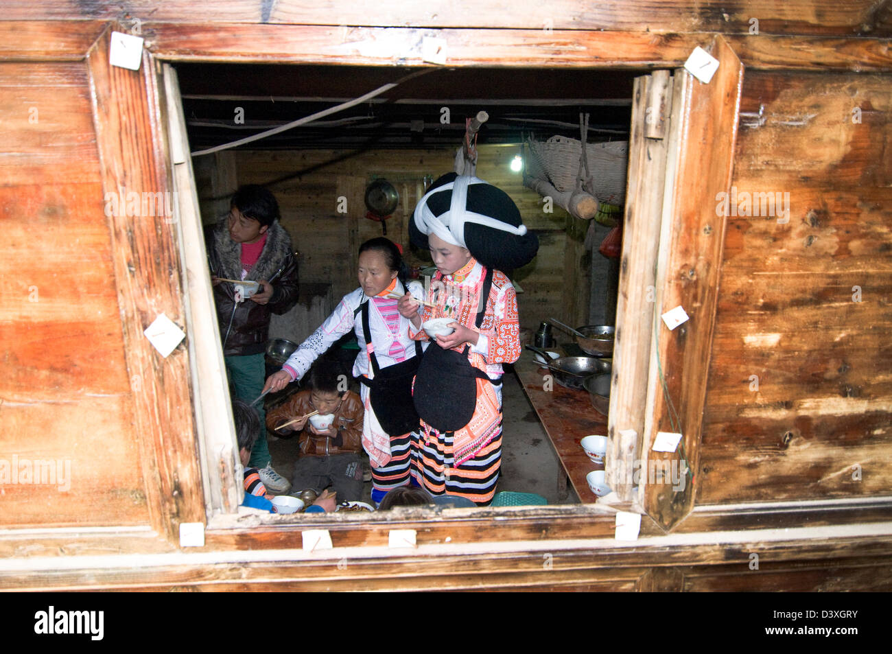 A Long Horn Miao family in eating lunch in their home Stock Photo - Alamy