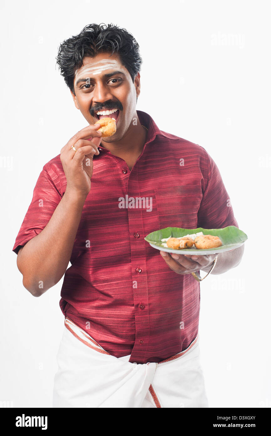 South Indian man having vada Stock Photo - Alamy