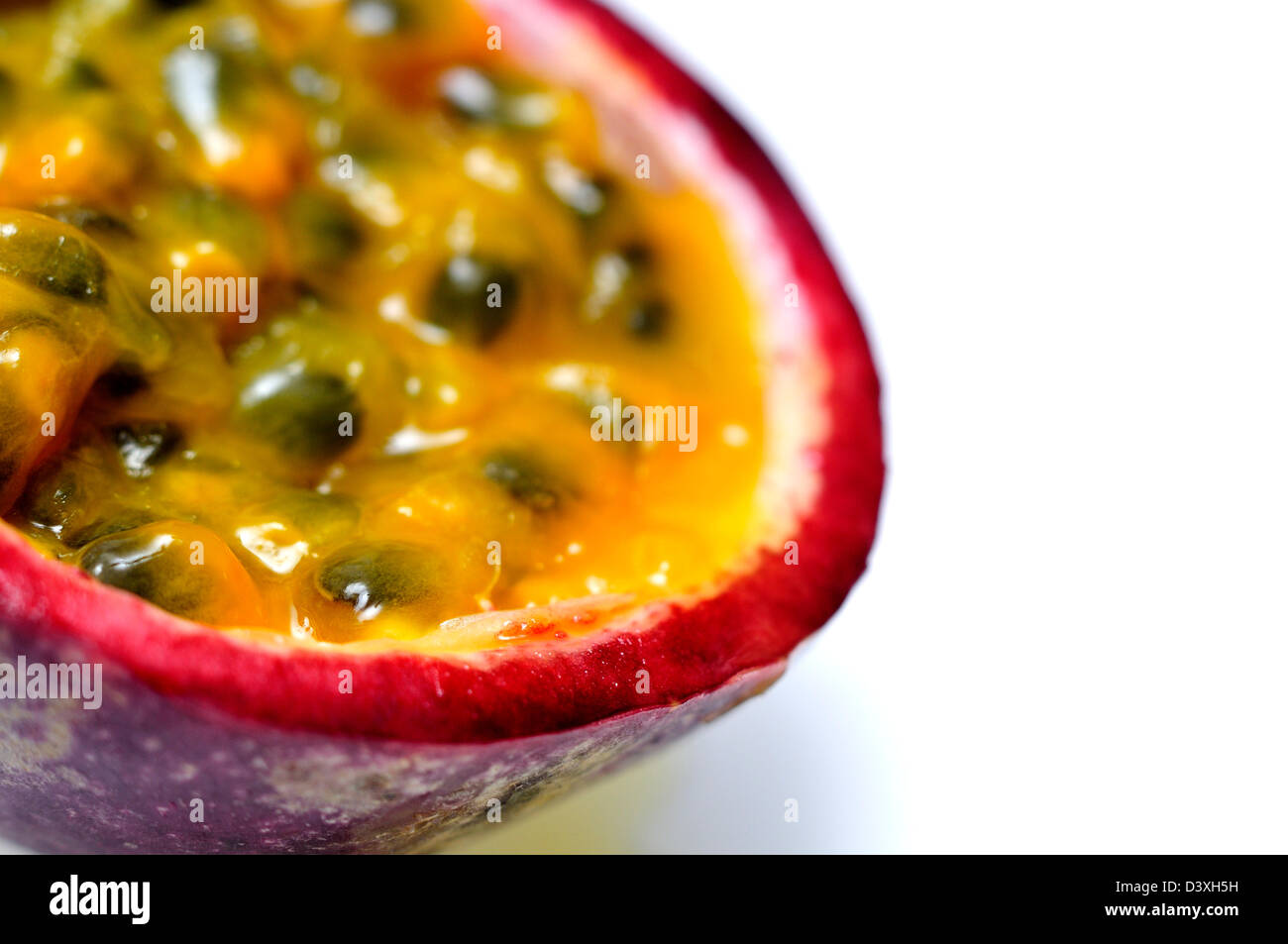 Passionfruit, cut open showing seeds and pulb Stock Photo - Alamy
