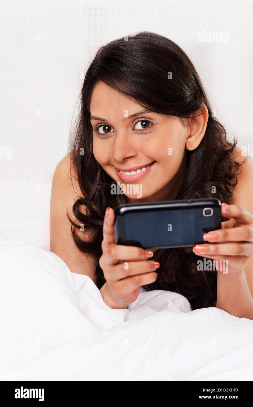 Woman text messaging on a mobile phone Stock Photo - Alamy