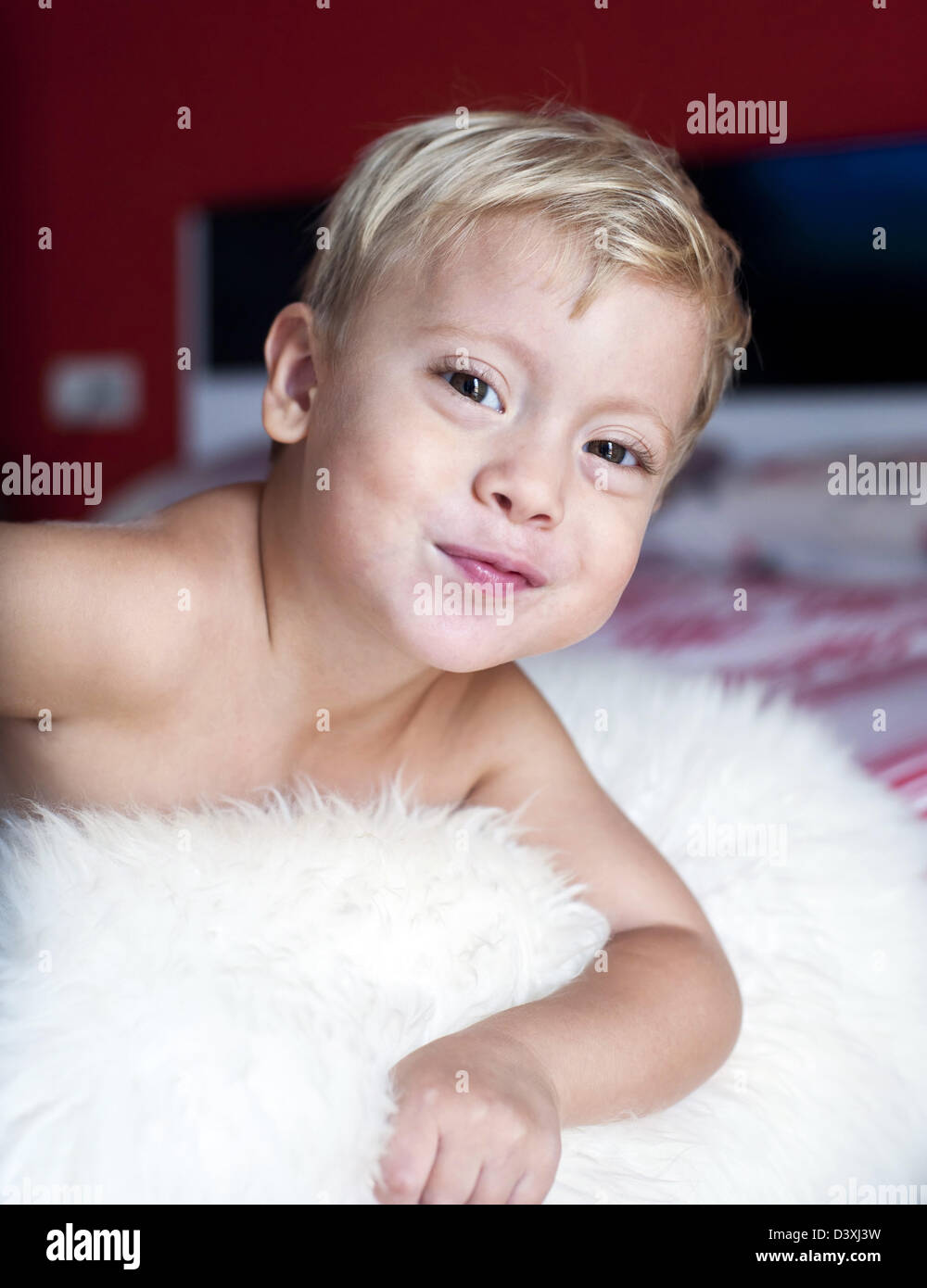 The little boy on a red background Stock Photo - Alamy