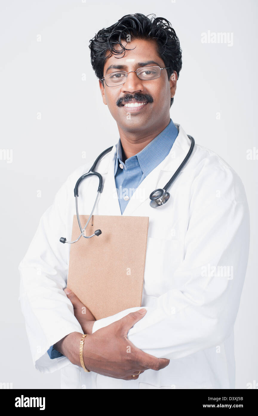 South Indian doctor smiling Stock Photo - Alamy