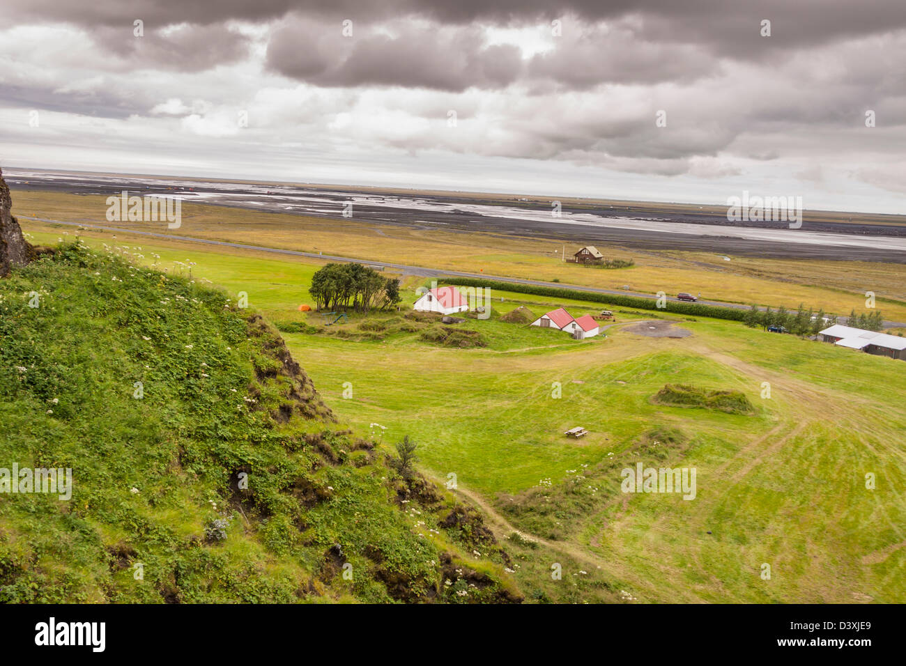 View from Seljalandsfoss waterfall to green farmland - Iceland Stock ...