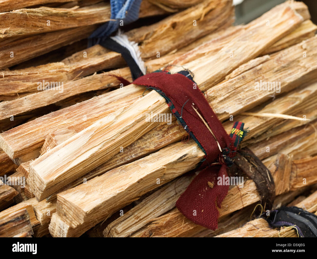 Bundle of kindling wood for sale at farmers market Stock Photo - Alamy
