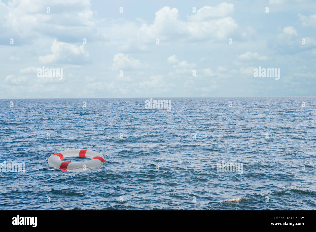 Life preserver floating in open ocean Stock Photo - Alamy