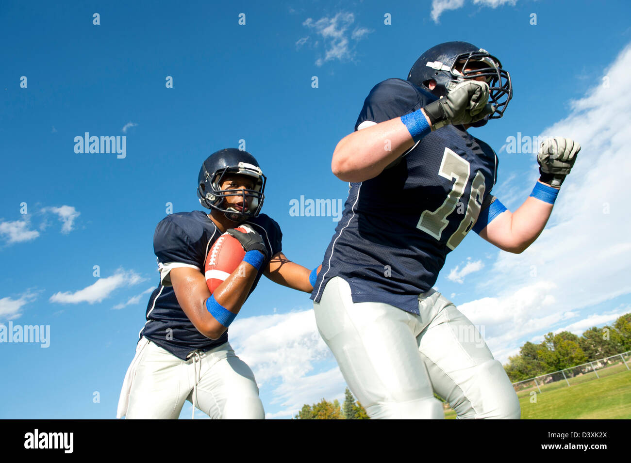 Football players passing ball Stock Photo - Alamy