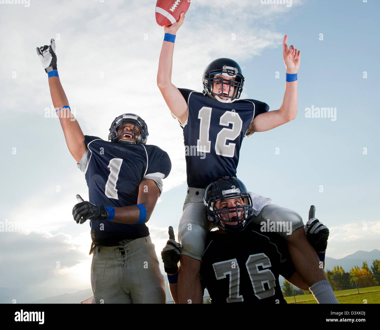 Football players cheering in game Stock Photo - Alamy