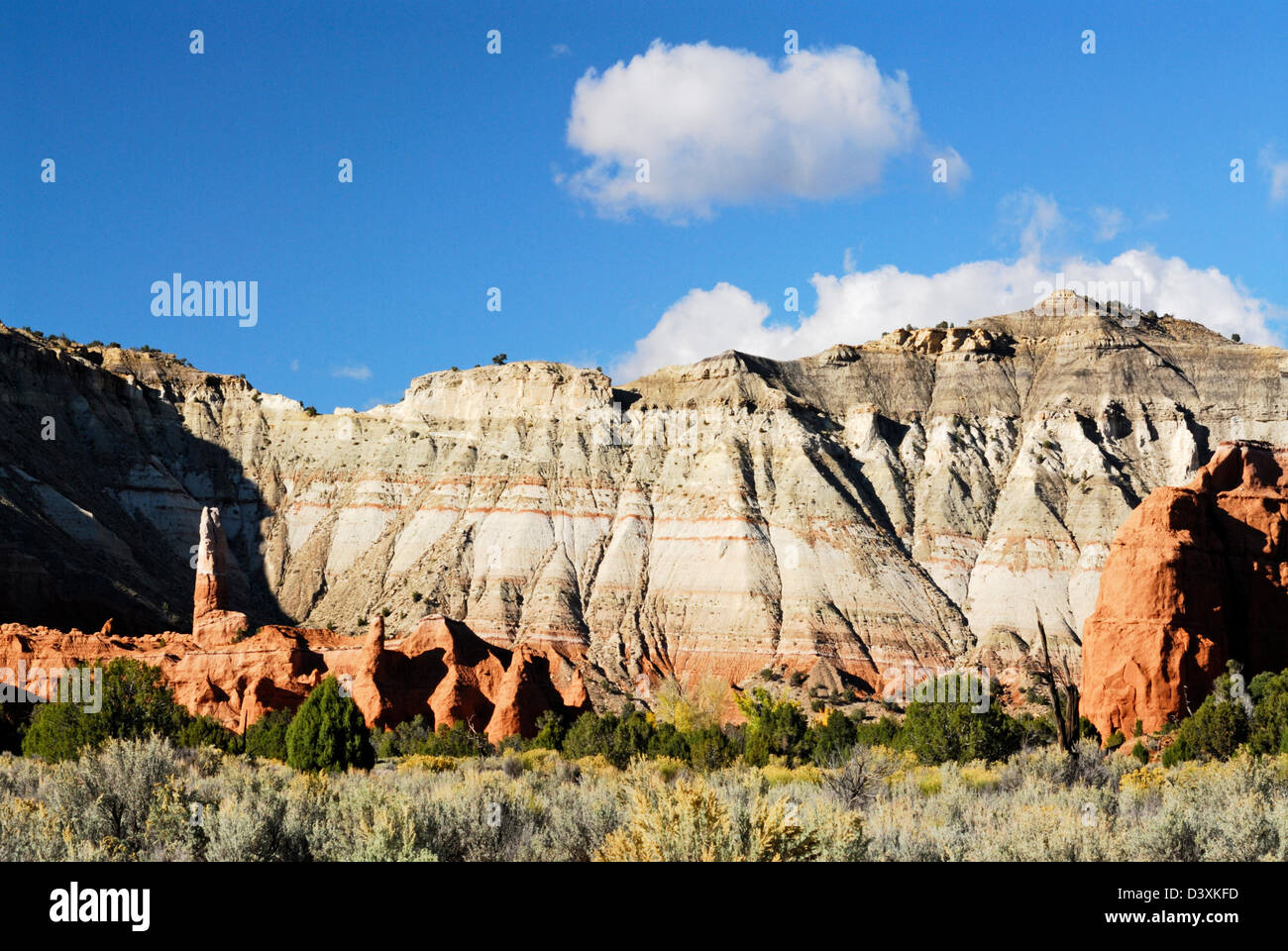 colorful rock formations under blue sky with cumulus clouds Stock Photo ...
