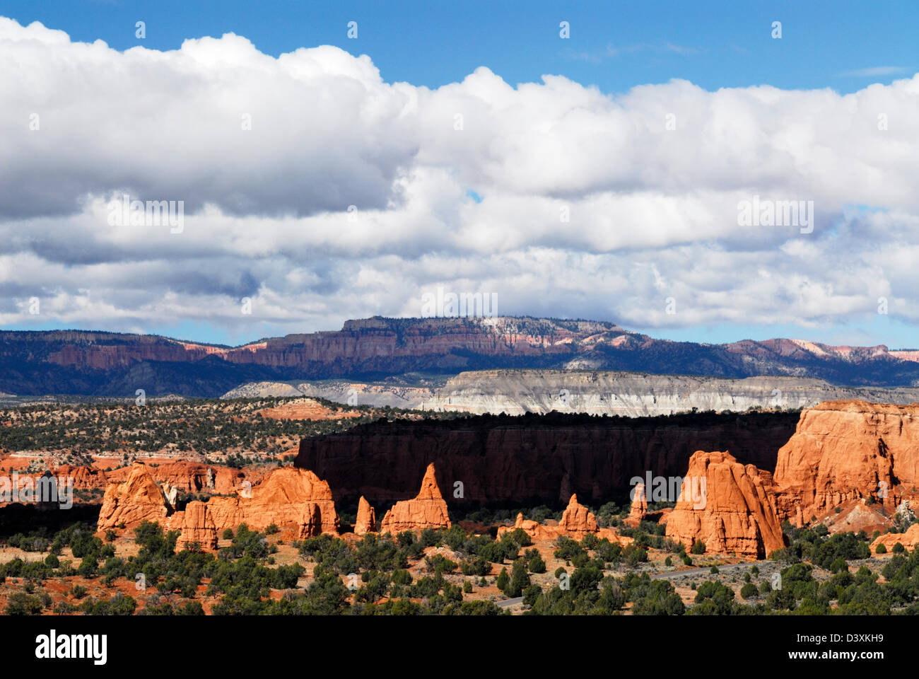 colorful rock formations under blue sky with cumulus clouds Stock Photo ...