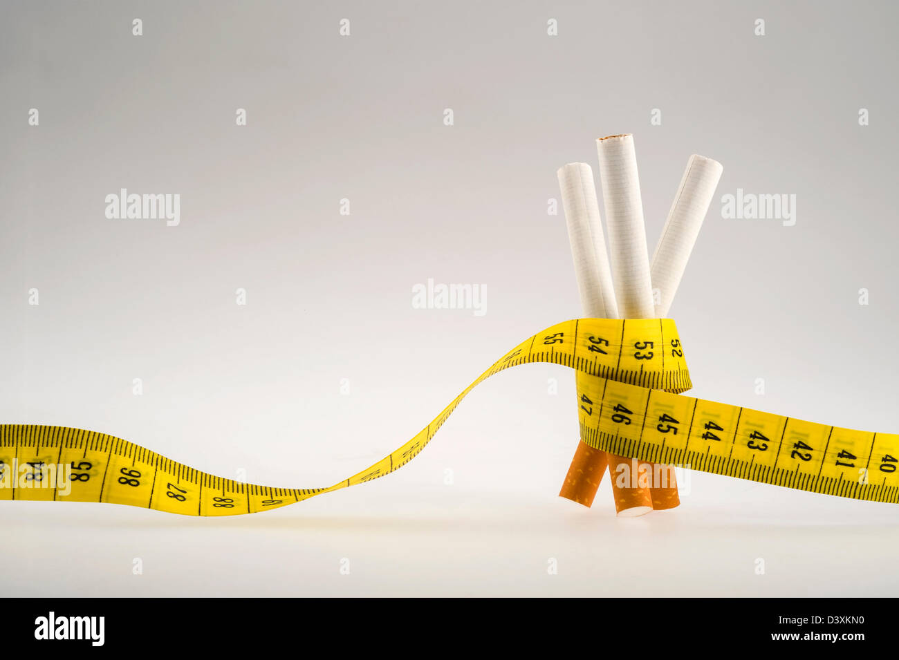 tape measure and cigarette Stock Photo - Alamy