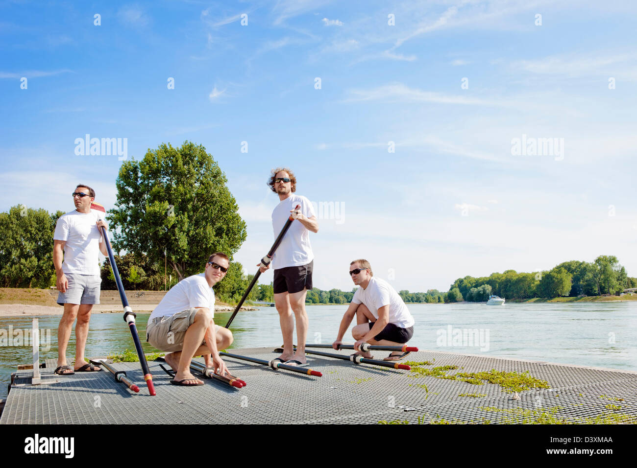 Teamwork Concept of Men Rowing Team Setting Paddles in Preparation ...