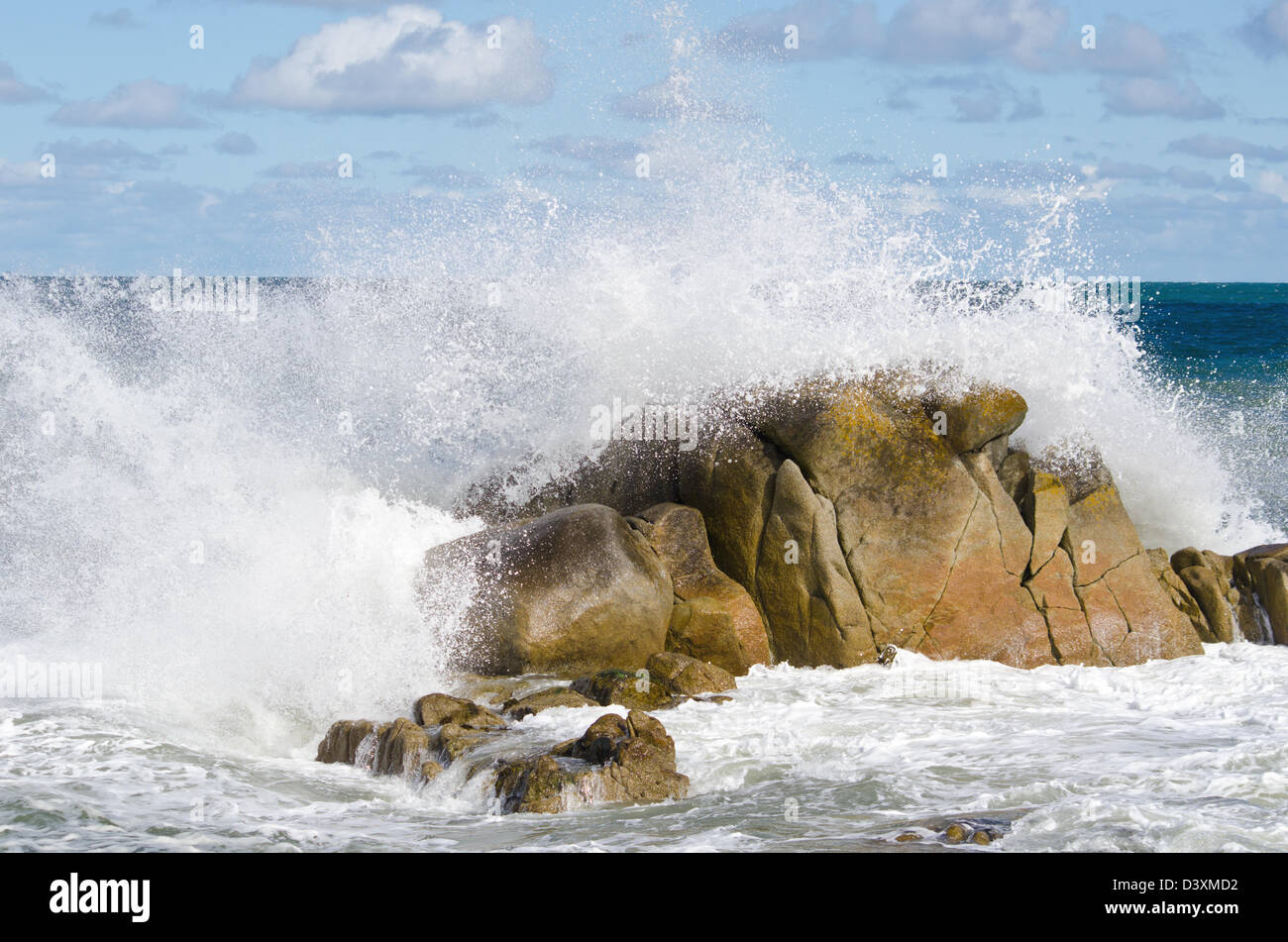 Wave crashes onto rocks Stock Photo - Alamy