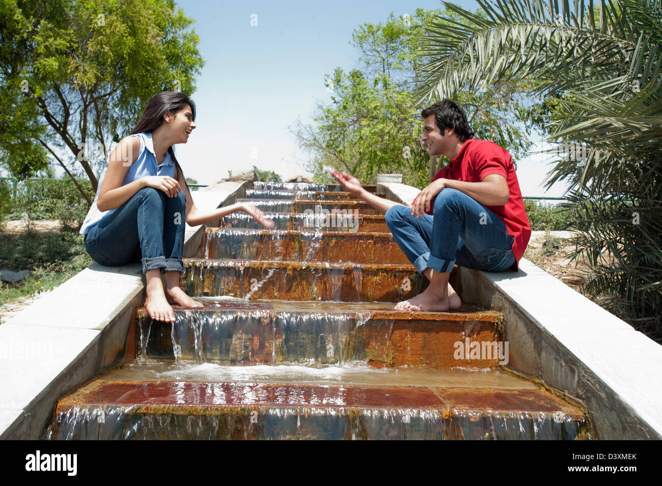Couple enjoying at waterfall in a park, Japanese Park, Rohini, Delhi ...