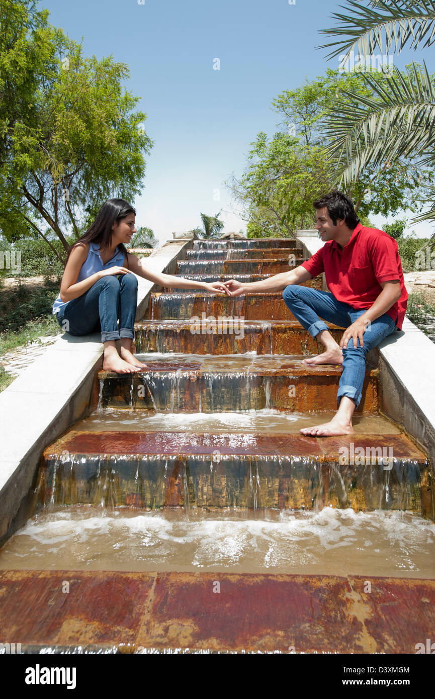 Couple enjoying at waterfall in a park, Japanese Park, Rohini, Delhi ...