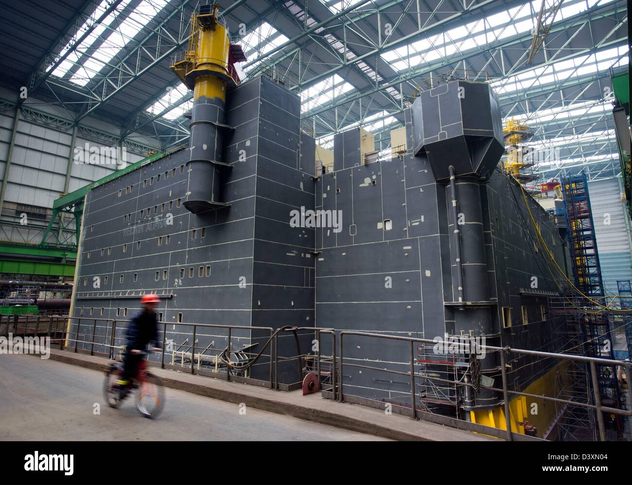 A ship builder passes the offshore platform 'HelWin alpha' at the ...