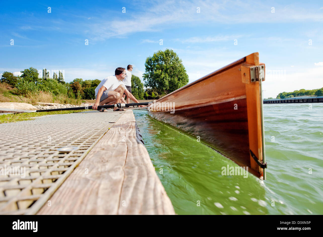 Teamwork Concept of Men Rowing Team Setting Paddles and Boat Stock ...