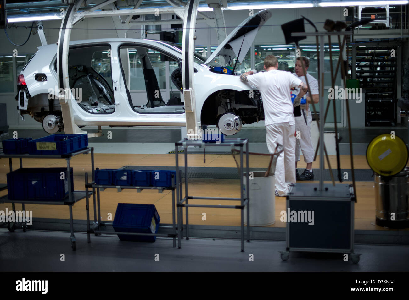 Volkswagen employees work in the production street for the Golf VII at ...