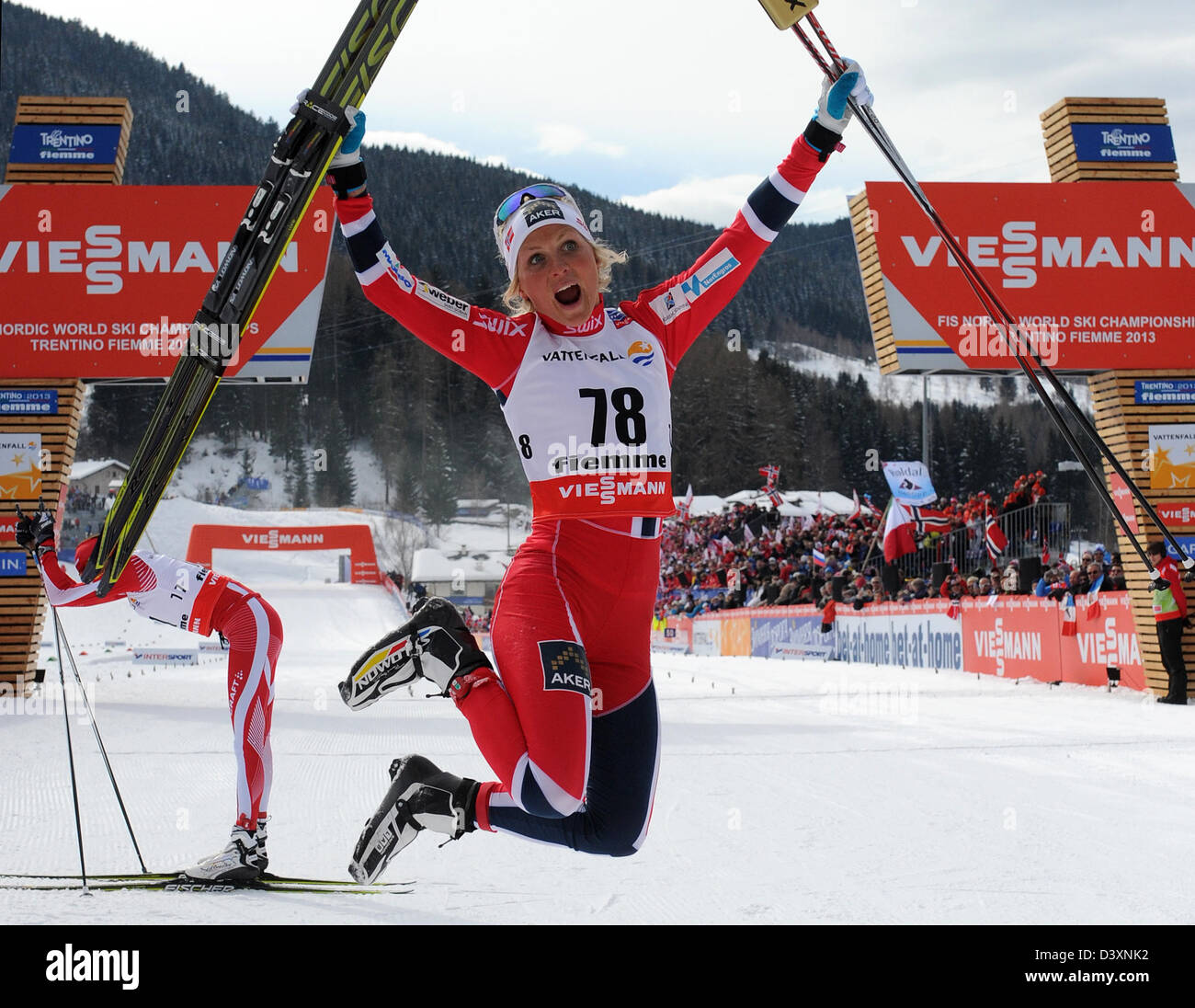 Norway's Therese Johaug celebrates in the finish area after winning the ...