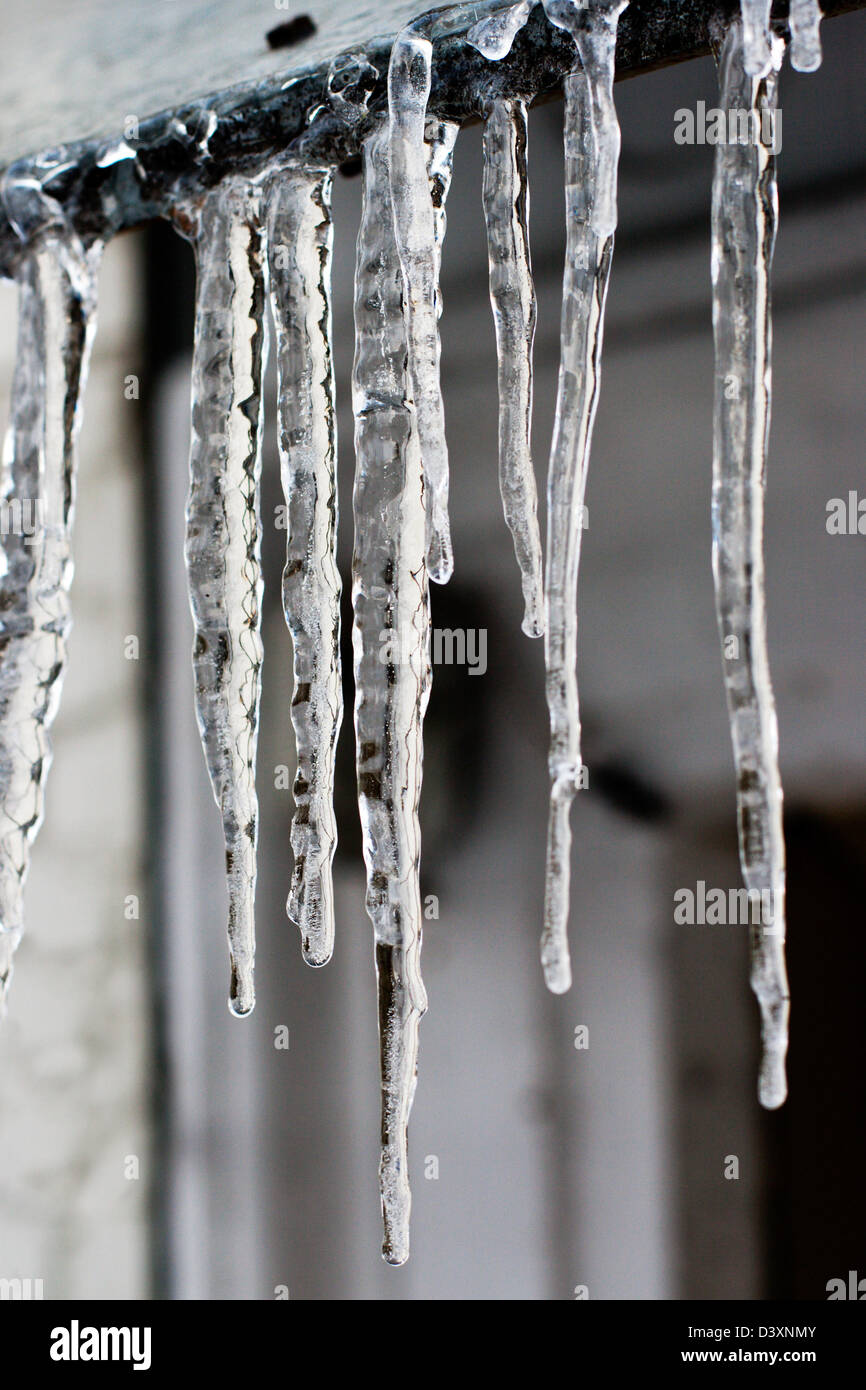 icicles which are hanging down from a roof Stock Photo - Alamy