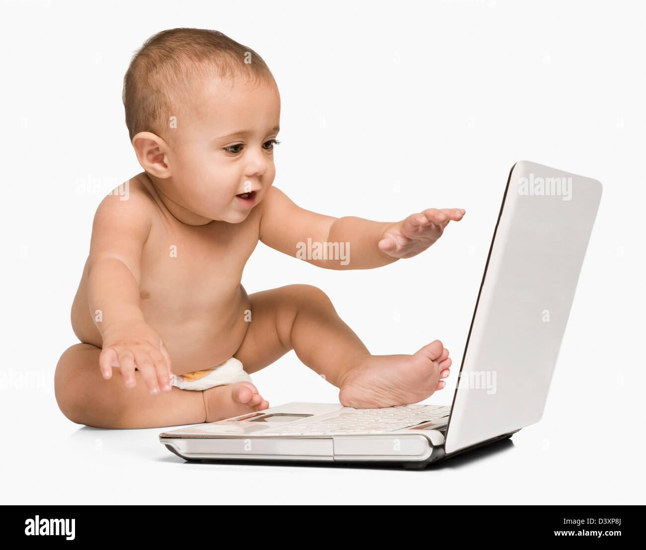 Baby boy using a laptop Stock Photo - Alamy
