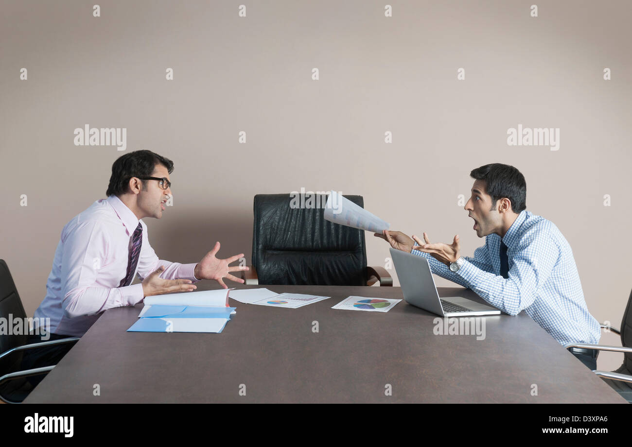 Two businessmen arguing to each other Stock Photo - Alamy