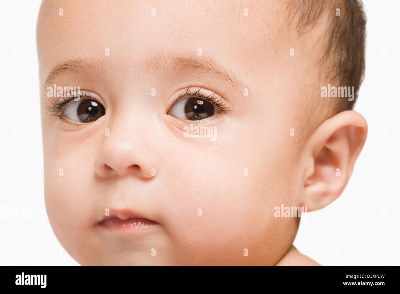 Close-up of a baby boy thinking Stock Photo - Alamy