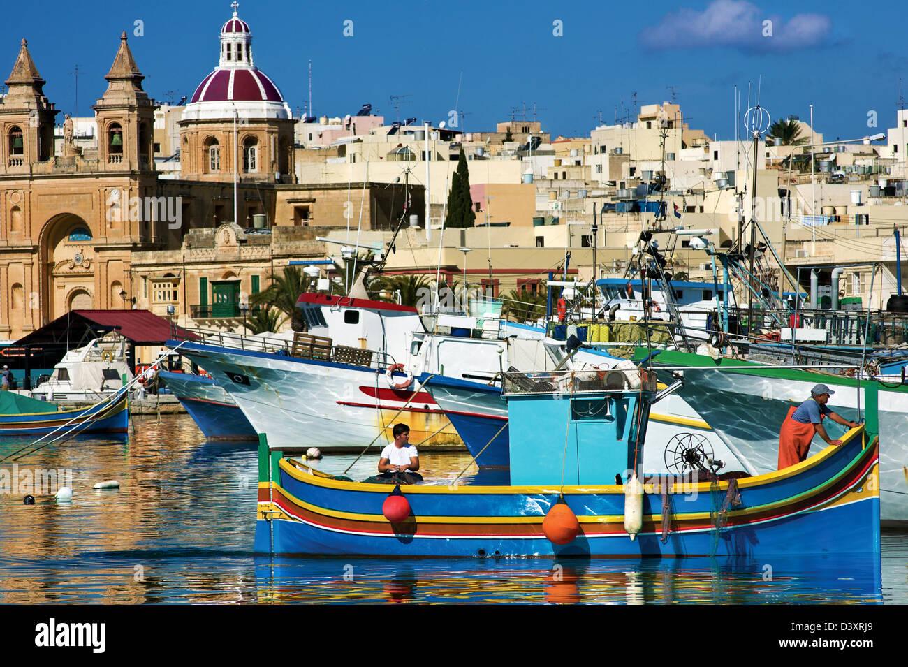 Fishermen on traditional Maltese fishing boat.Marsaxlokk,Malta Stock ...