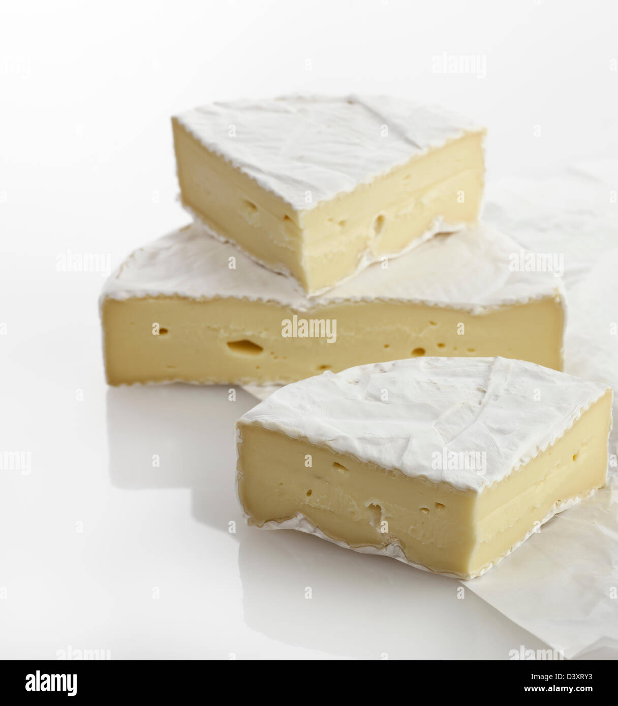 Wedges Of French Brie Cheese On White Background Stock Photo - Alamy