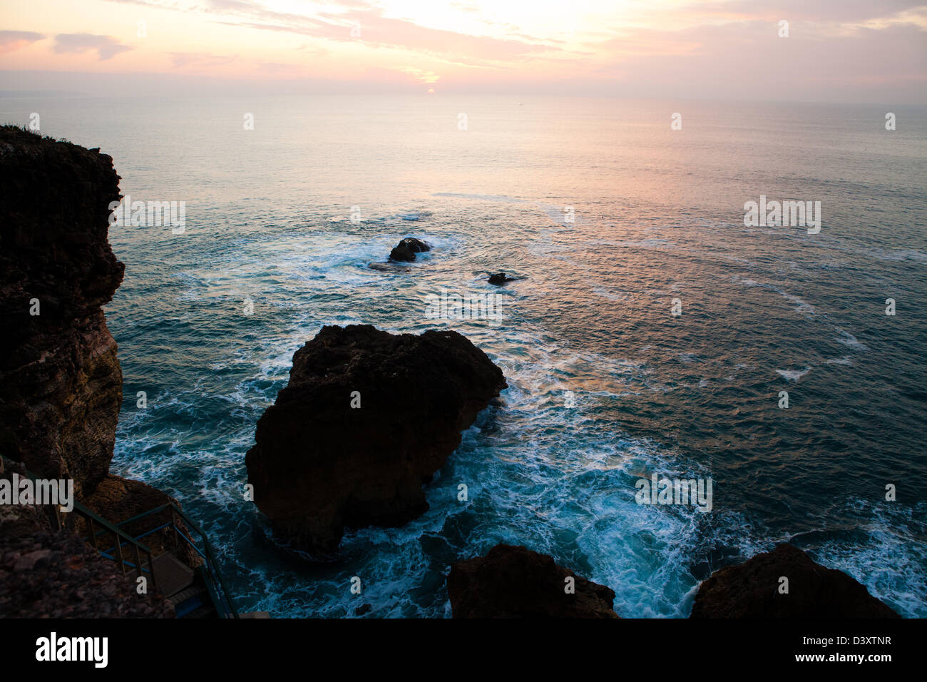 Sunset on the coast at Nazare Portugal Stock Photo - Alamy