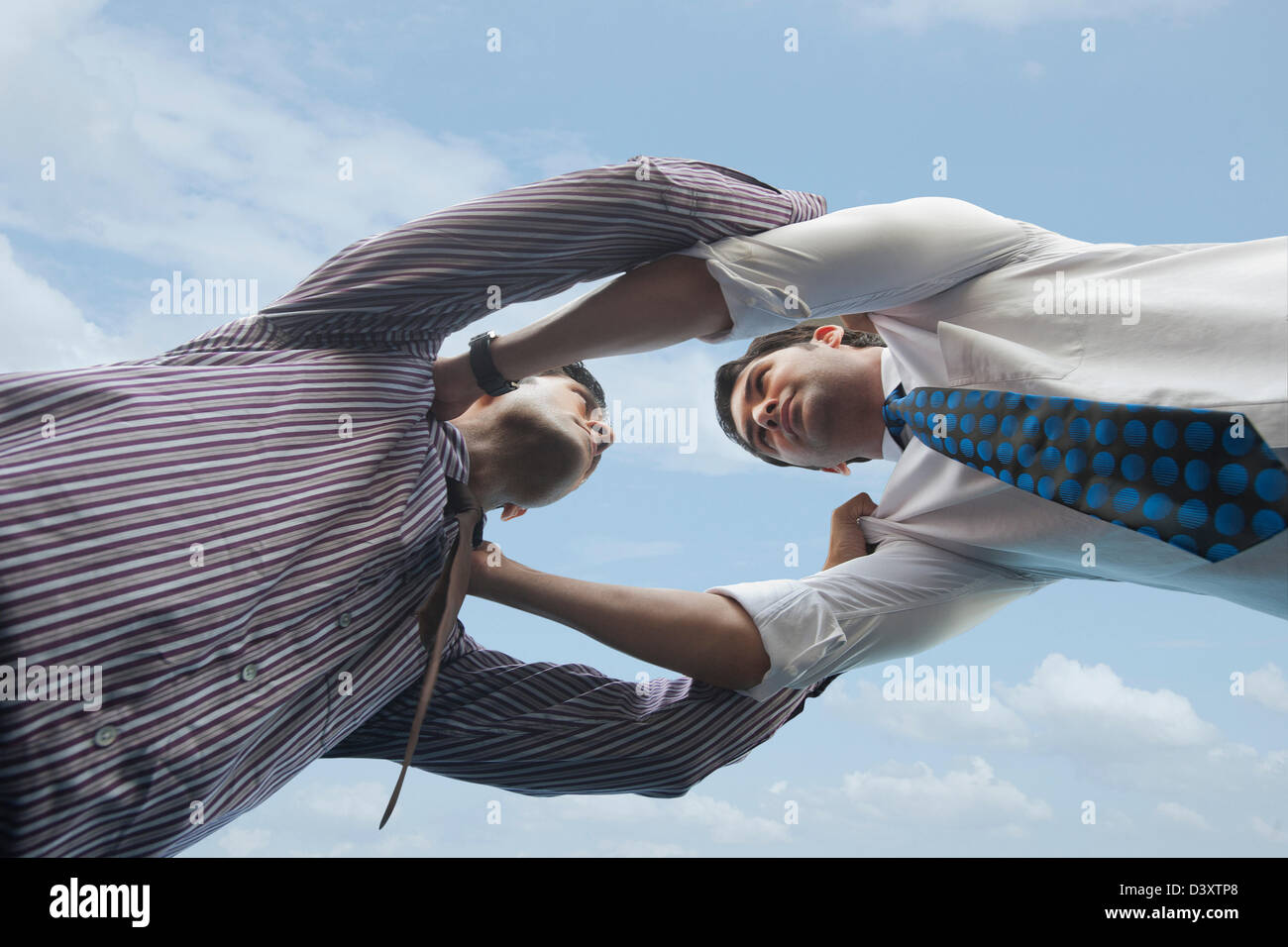 Two businessmen fighting to each other Stock Photo - Alamy