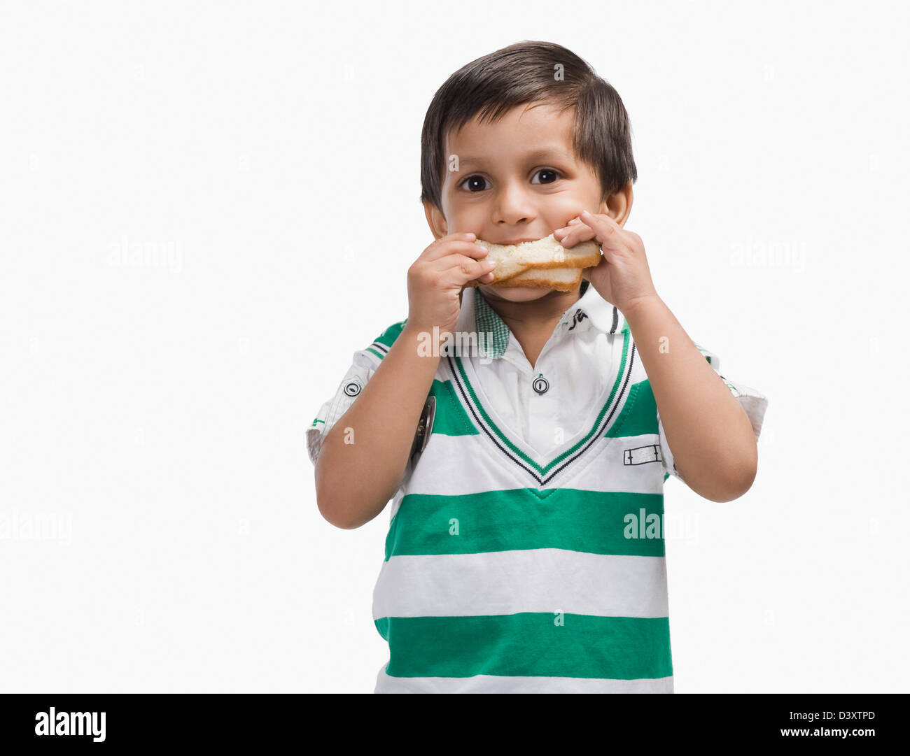 Boy eating bread Stock Photo - Alamy