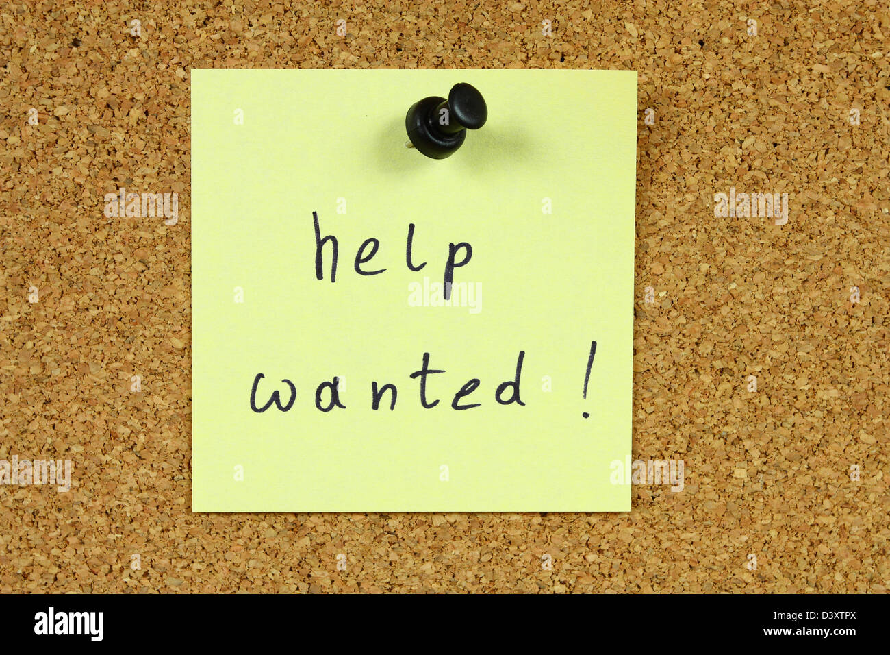 Yellow small sticky note on an office cork bulletin board. Employment ...