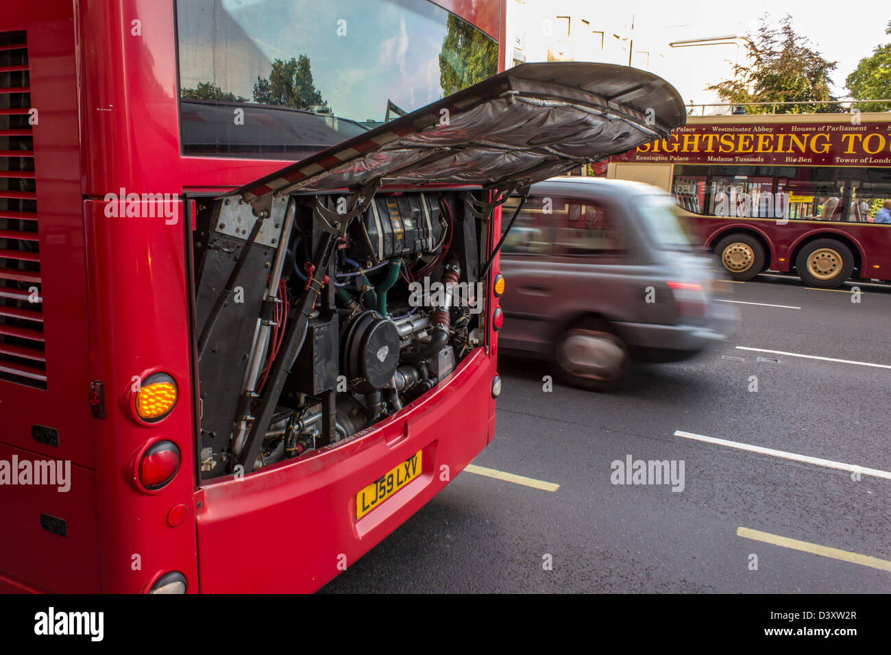 London Transit bus broken down on a city street with engine cover open ...