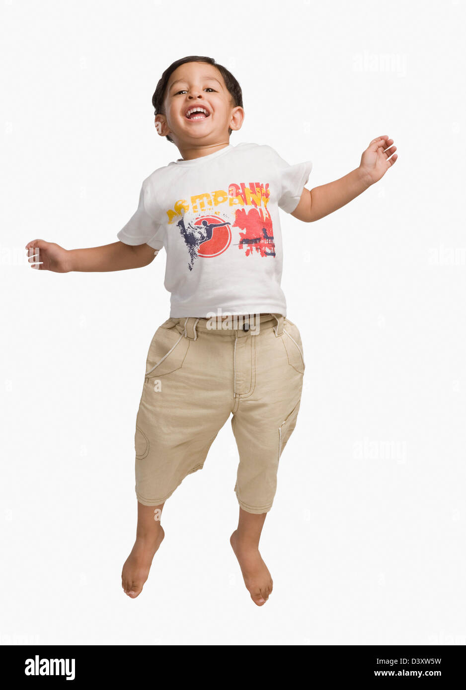 Baby boy jumping and smiling Stock Photo - Alamy