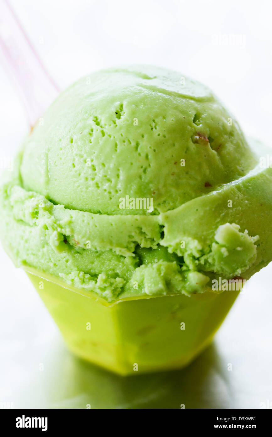 Green gelato in green plastic cup Stock Photo - Alamy