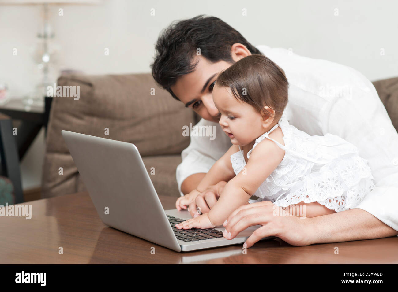 Father computer baby on lap hi-res stock photography and images - Alamy