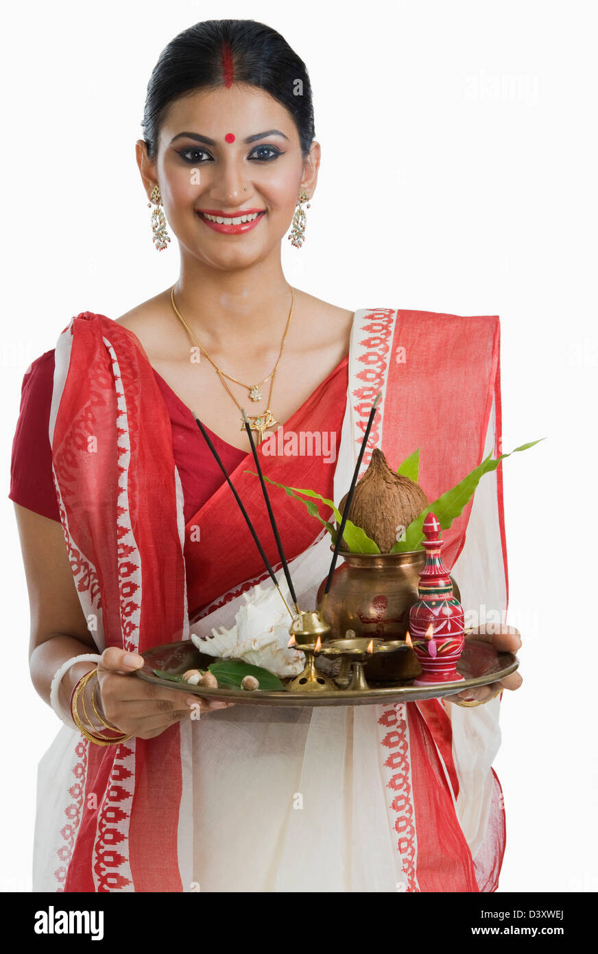 Bengali woman holding a puja thali Stock Photo - Alamy