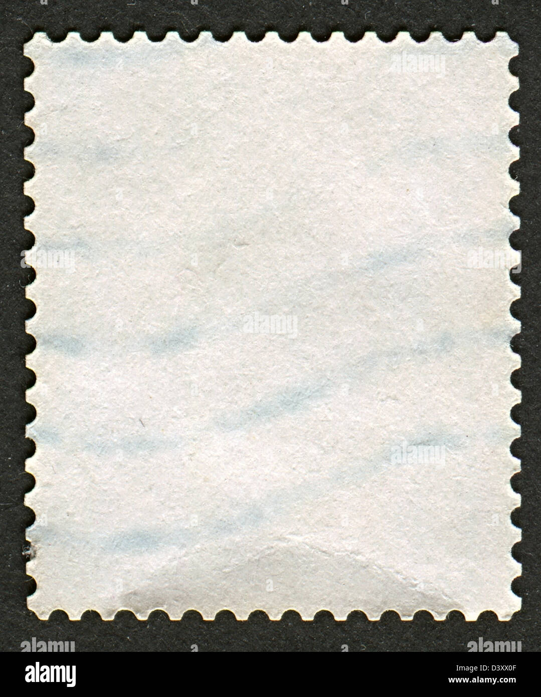 The reverse side of a postage stamp Stock Photo - Alamy