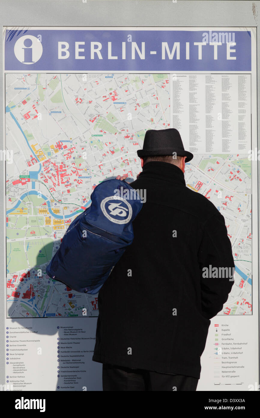Berlin, Germany, the man looks at a map on the Alexanderplatz Stock ...