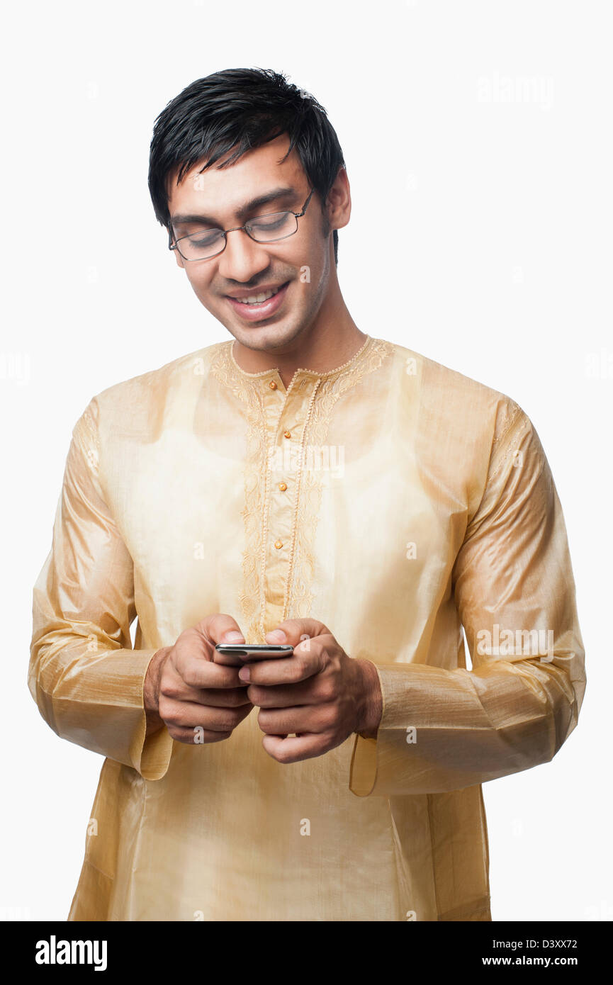 Bengali man text messaging on a mobile phone Stock Photo - Alamy
