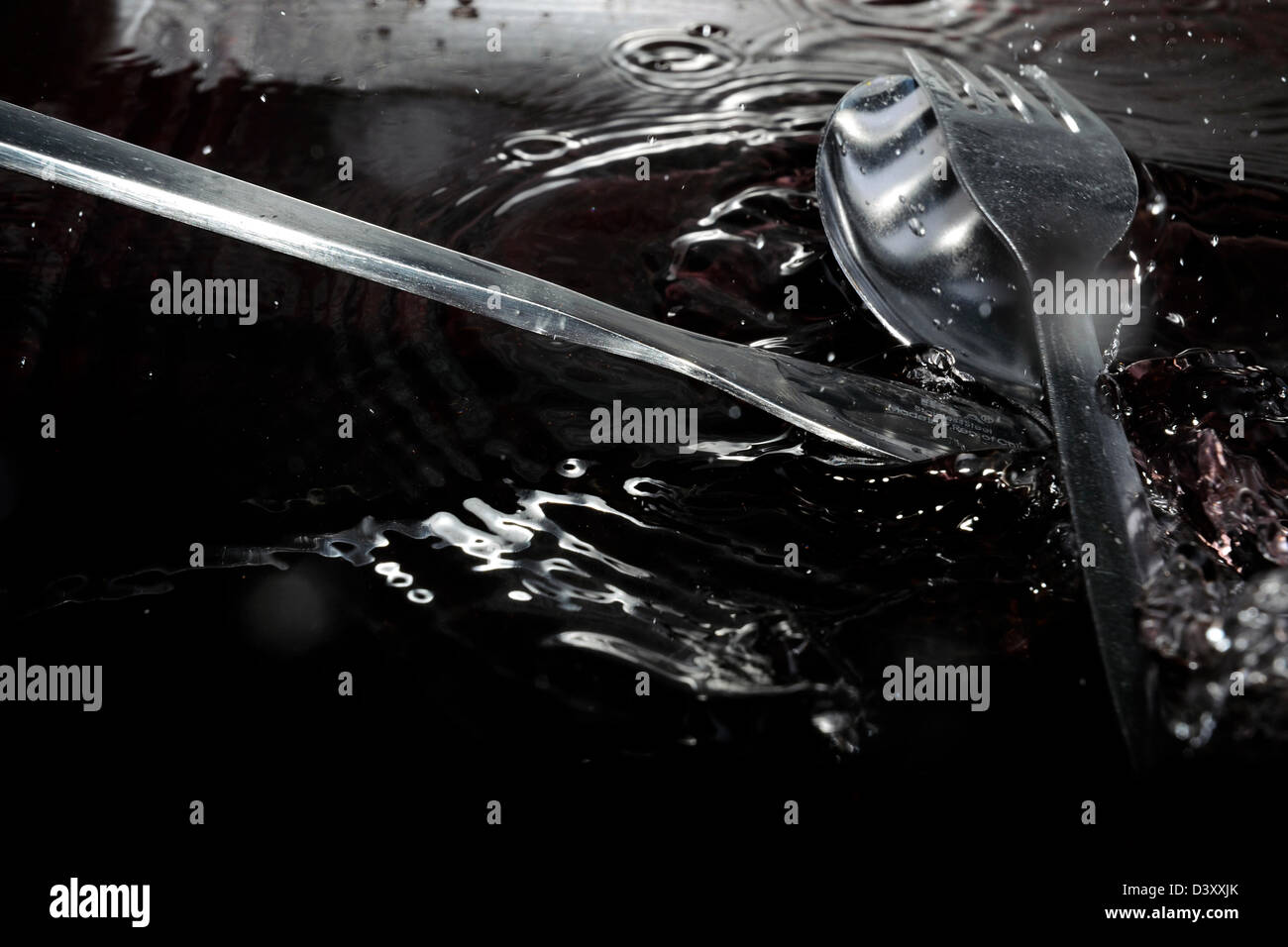 knife and fork splash Stock Photo - Alamy