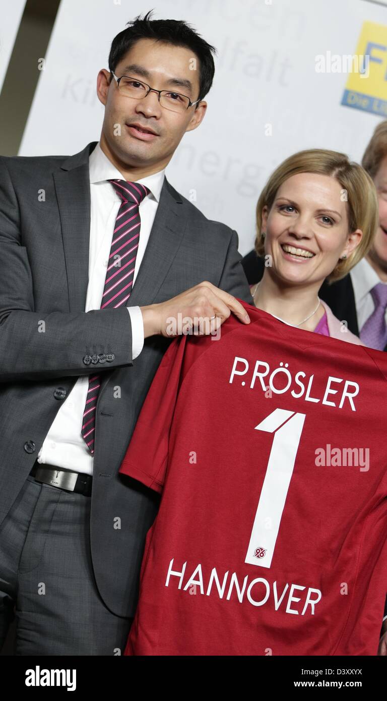 German Federal Economics Minister Philipp Roesler receives a present ...