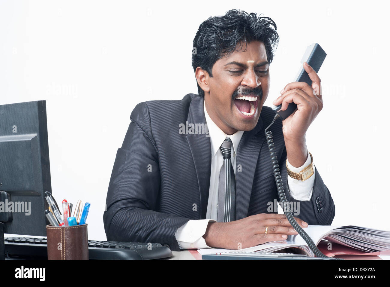 South Indian businessman working in an office and shouting Stock Photo ...