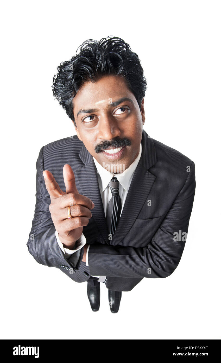 South Indian businessman thinking Stock Photo - Alamy