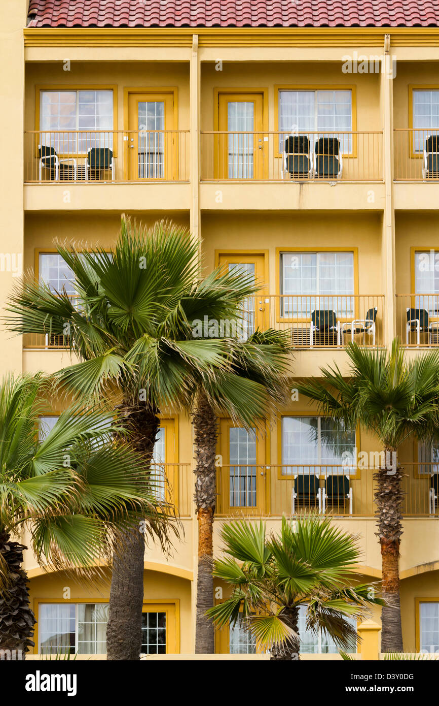 Yellow hotel with balconies Stock Photo - Alamy