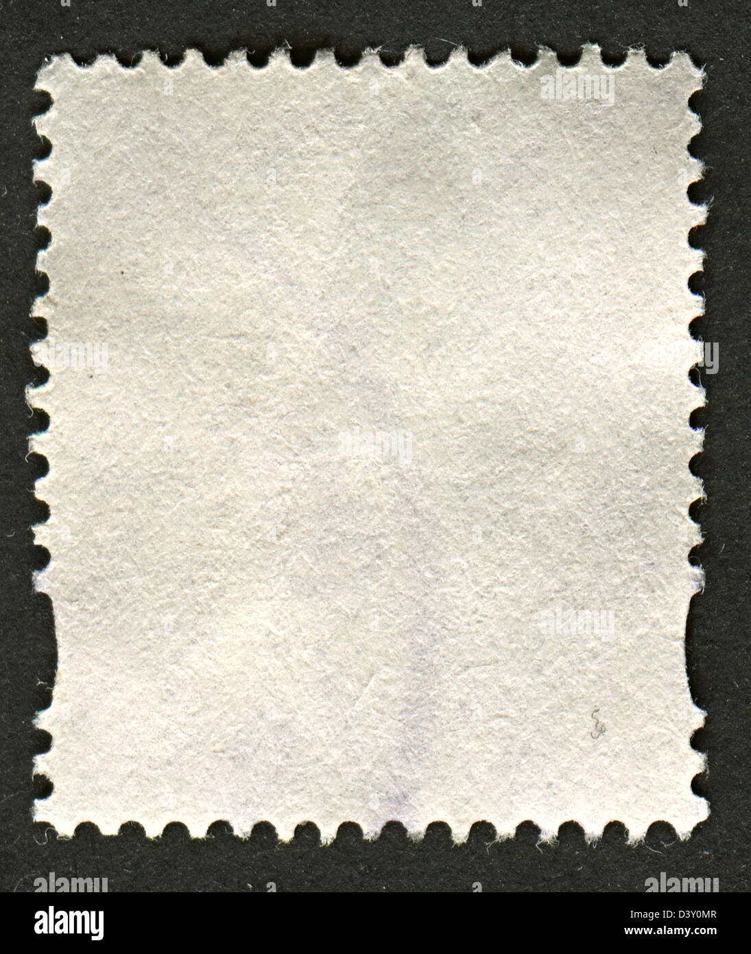 The reverse side of a postage stamp Stock Photo - Alamy
